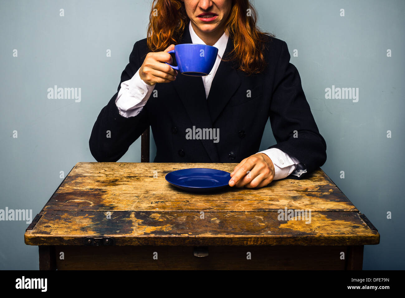 Young businesswoman sees something disgusting in her coffee Stock Photo ...