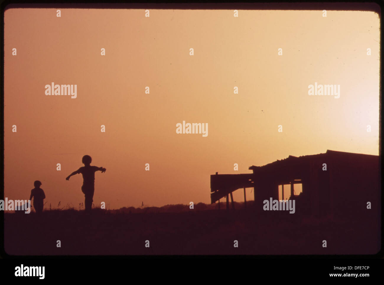 Children playing at sunset near their home in Ripley, capturing the joy ...