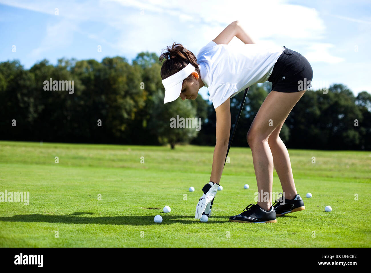 Girl playing golf Stock Photo - Alamy
