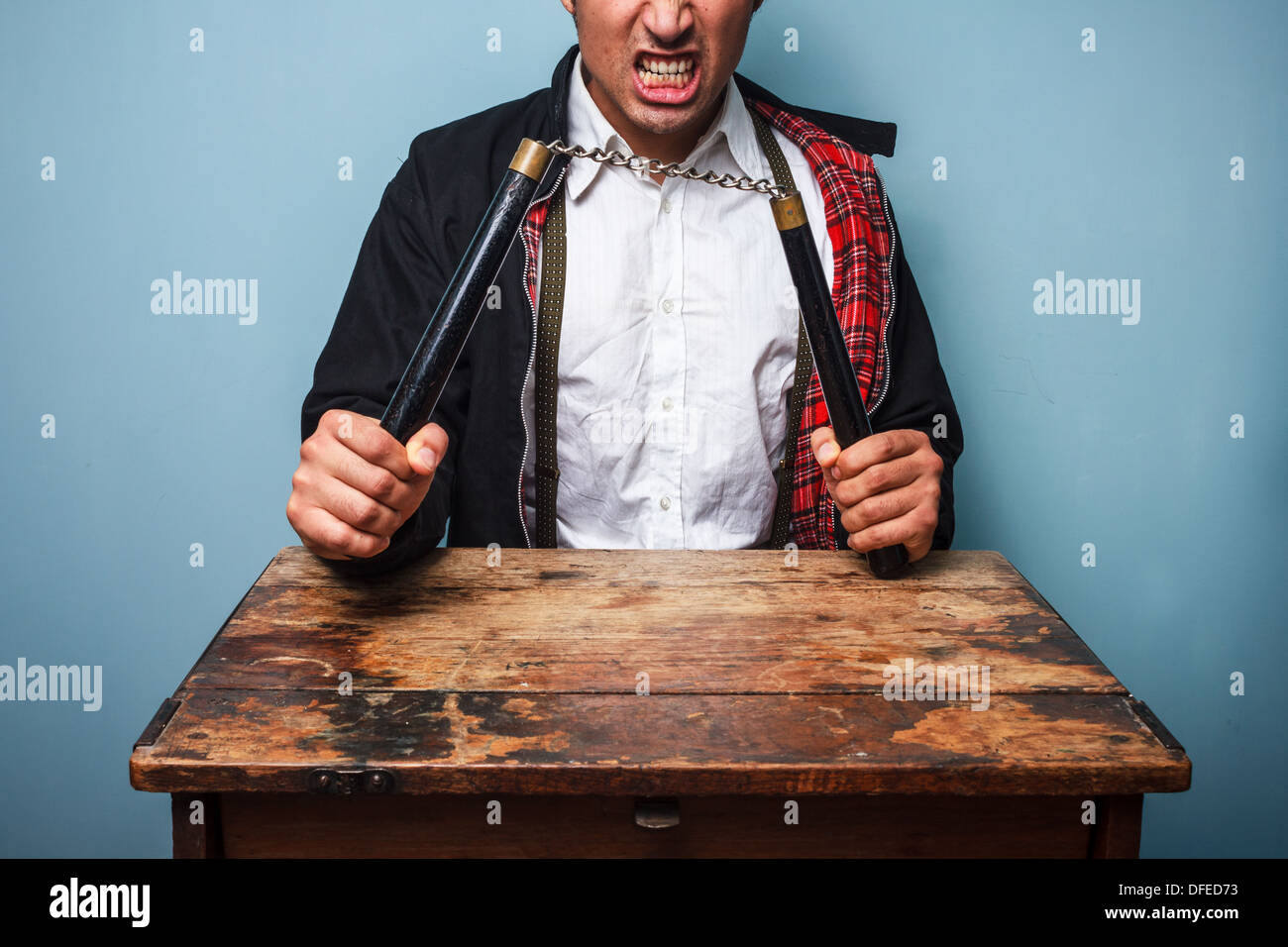 Angry man sitting table in hi-res stock photography and images - Alamy
