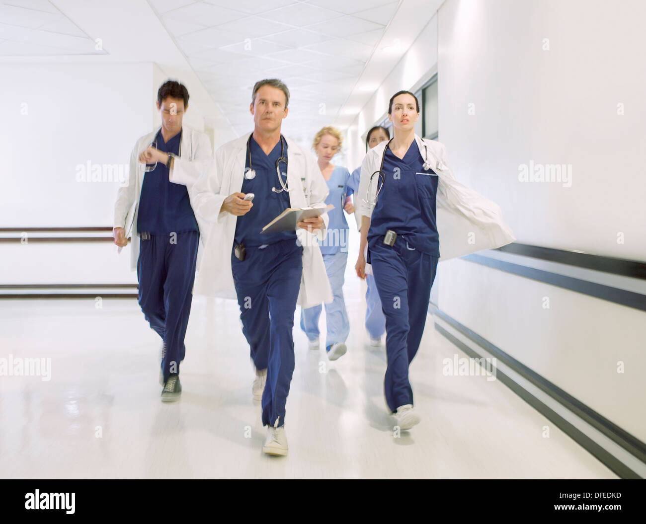Doctors rushing down hospital corridor hi-res stock photography and ...