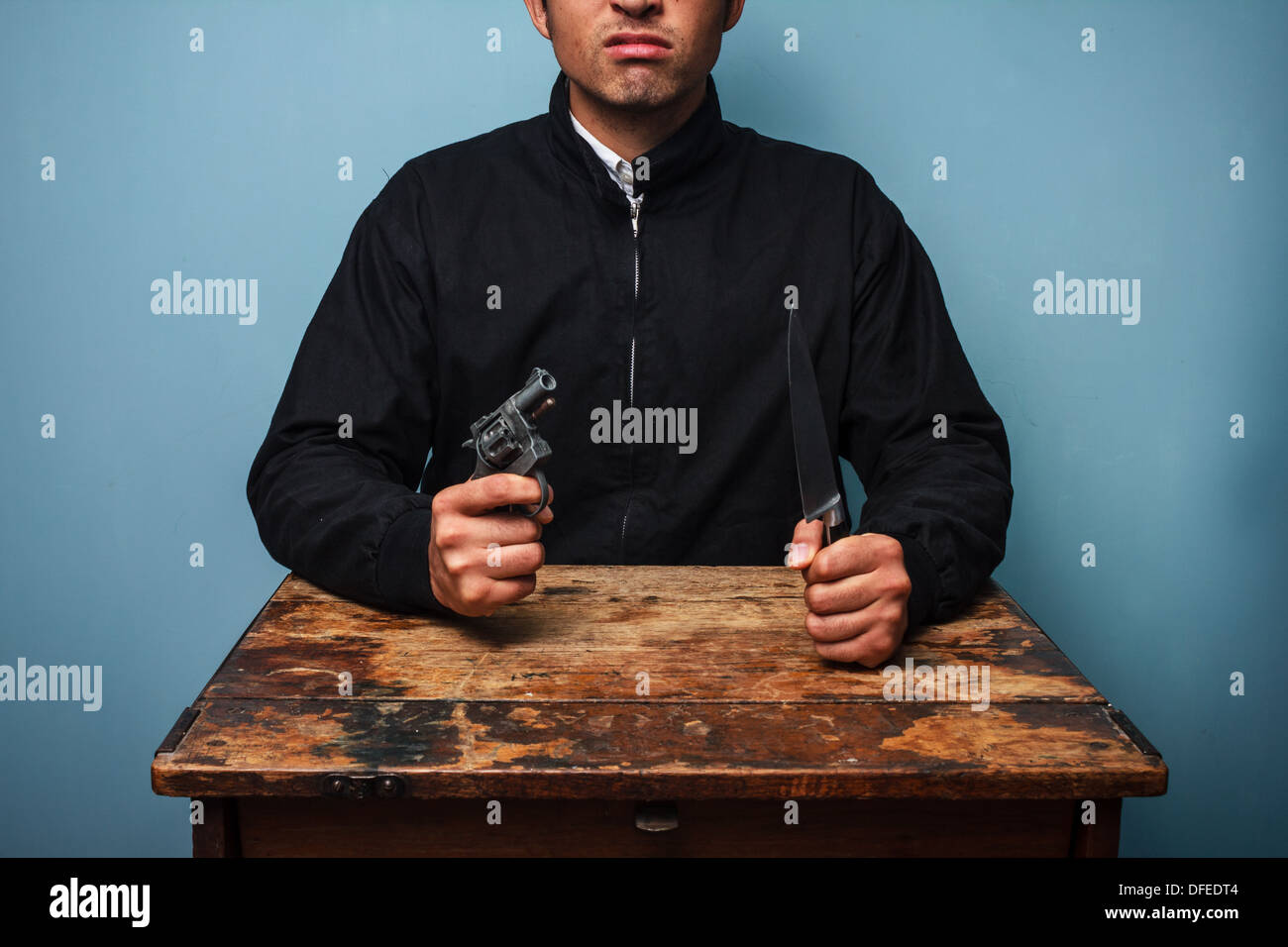 Pistol sitting threat weapon hi-res stock photography and images - Alamy