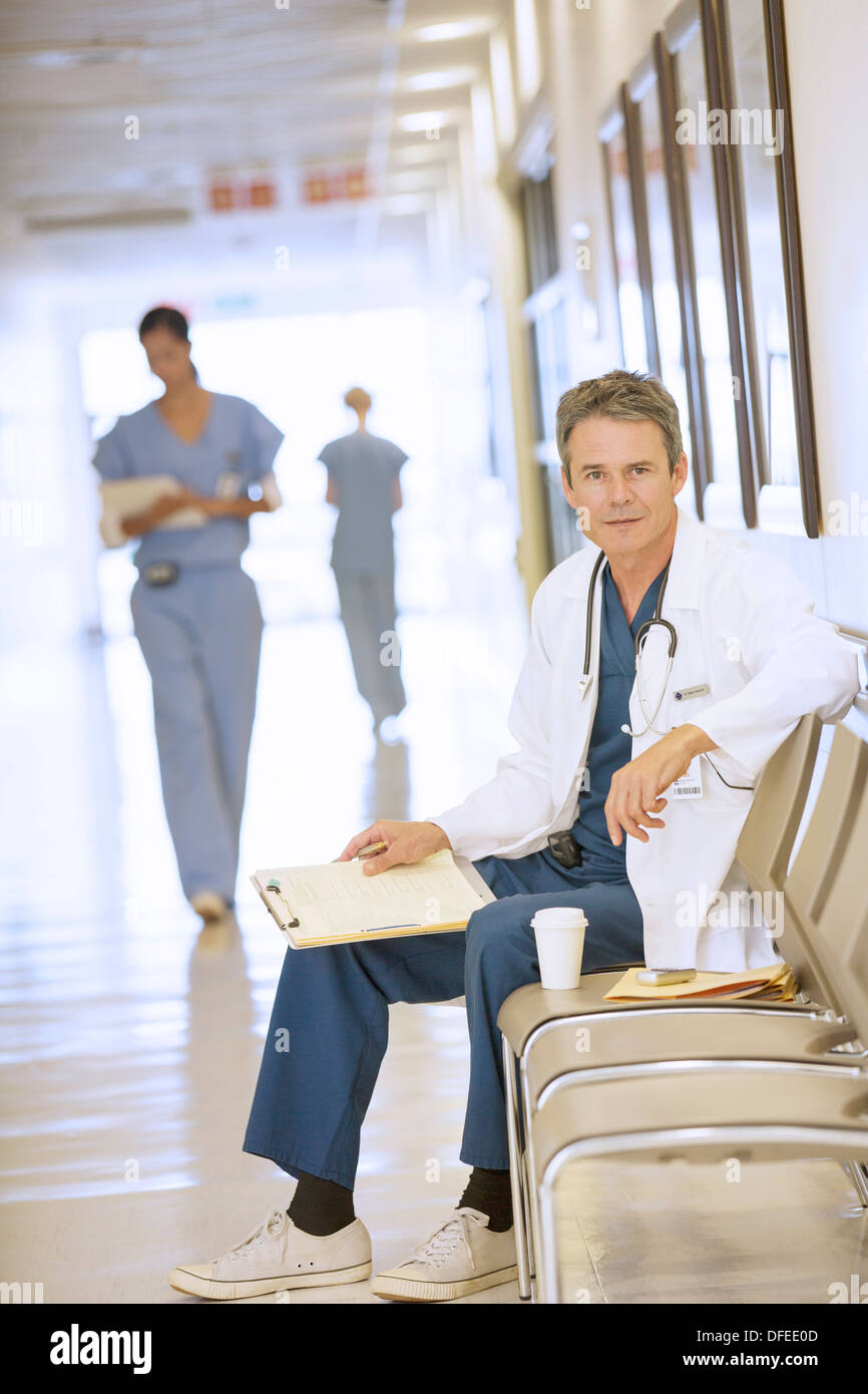 Portrait of serious doctor in hospital corridor Stock Photo - Alamy