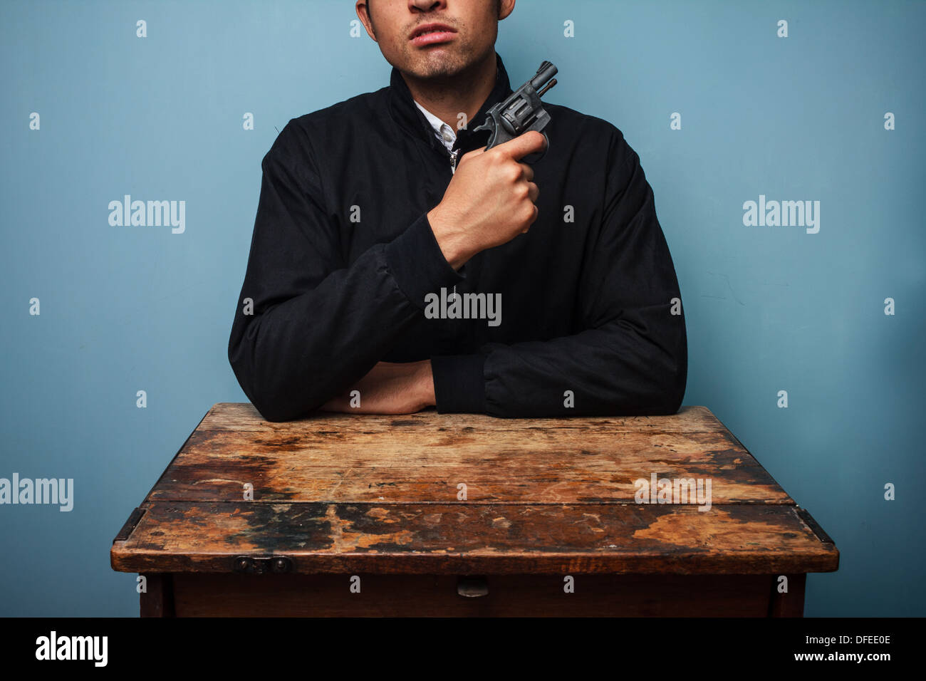 Pistol sitting threat weapon hi-res stock photography and images - Alamy