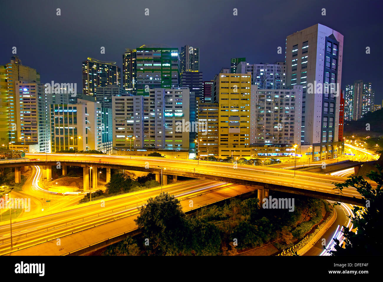 Colorful city night with buildings and bridge Stock Photo - Alamy