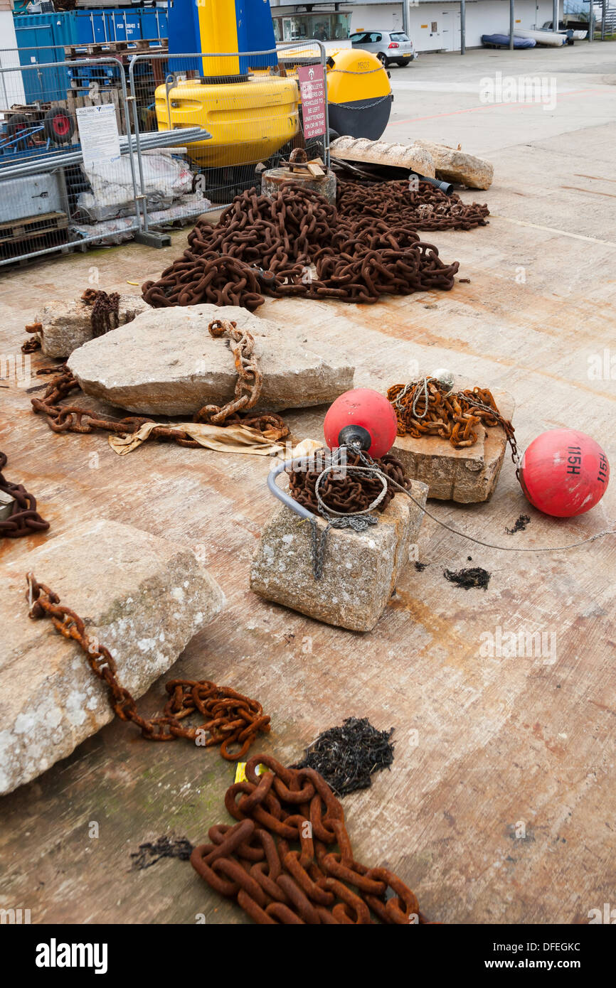boatyard chains anchors and buoys Stock Photo - Alamy