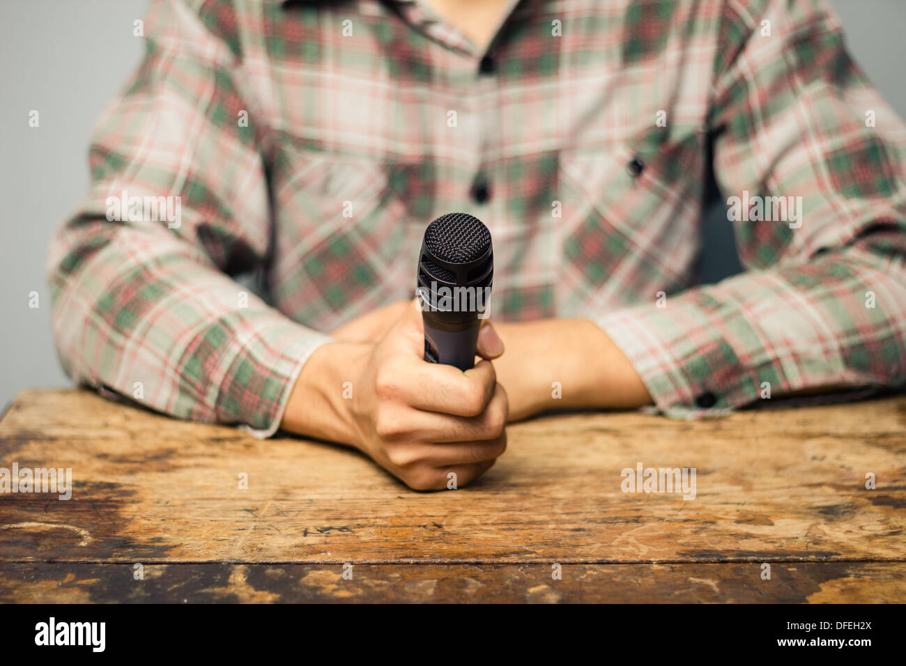 Seated sitting speaking media microphone hi-res stock photography and ...