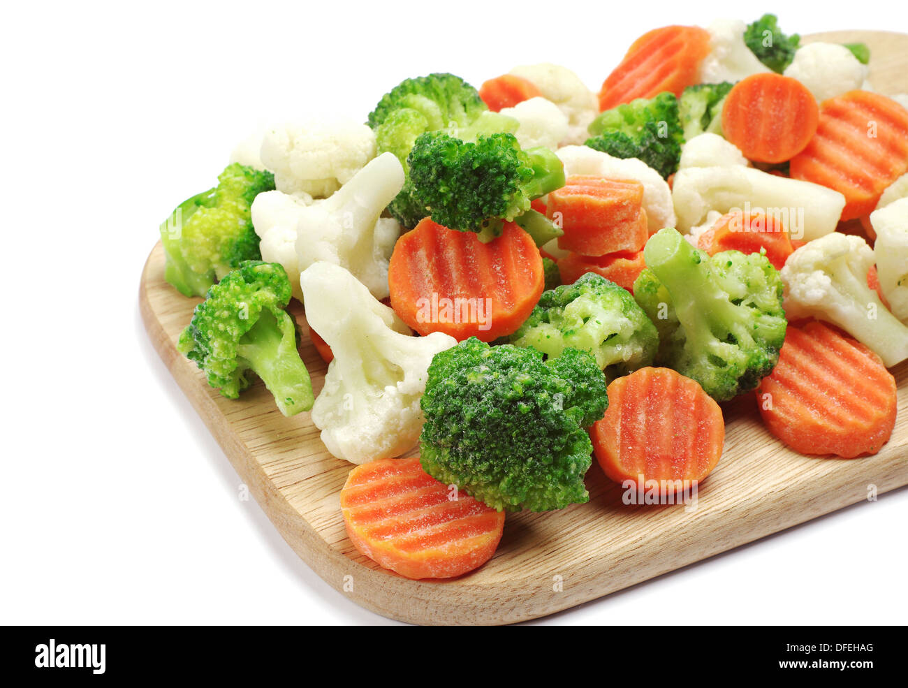 Different frozen vegetables on a cutting board Stock Photo - Alamy