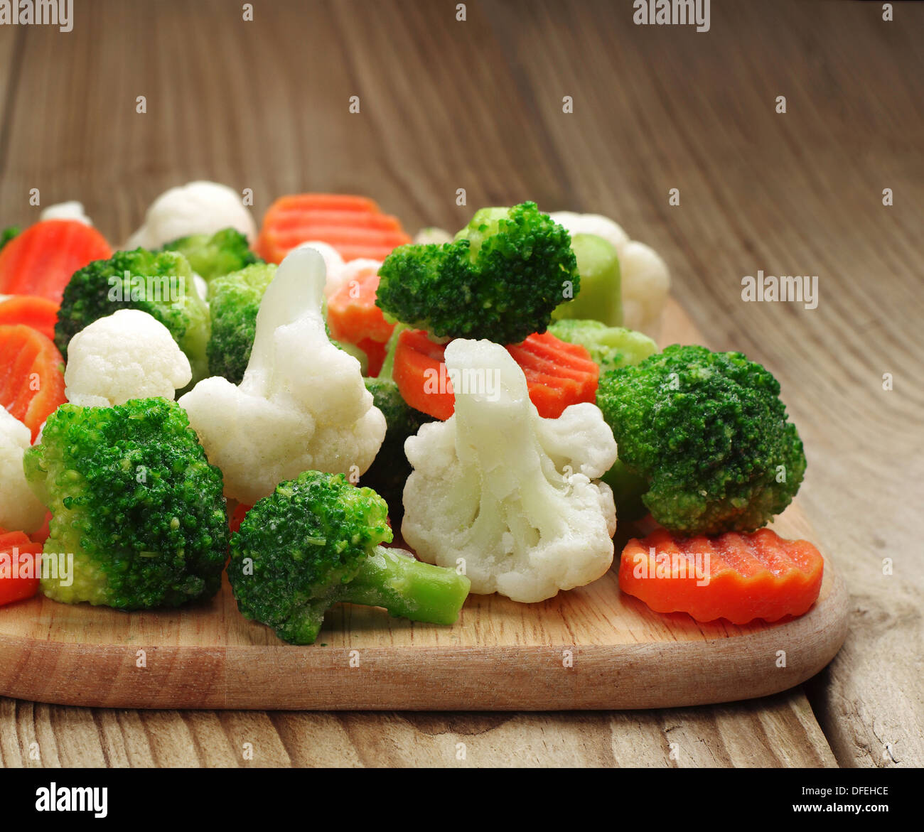 Different vegetables frozen on a cutting board Stock Photo - Alamy