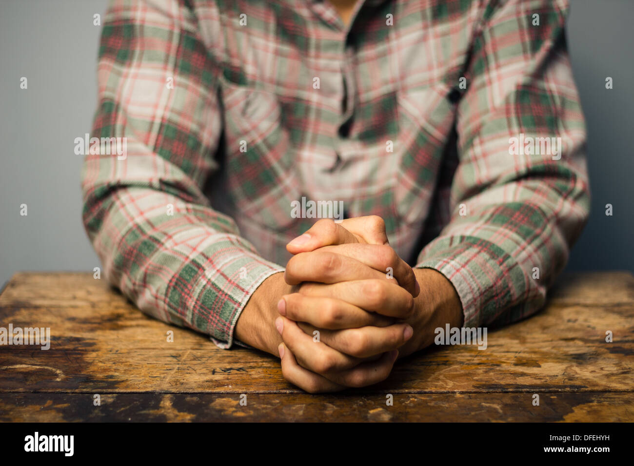 Man praying folded hands hi-res stock photography and images - Alamy