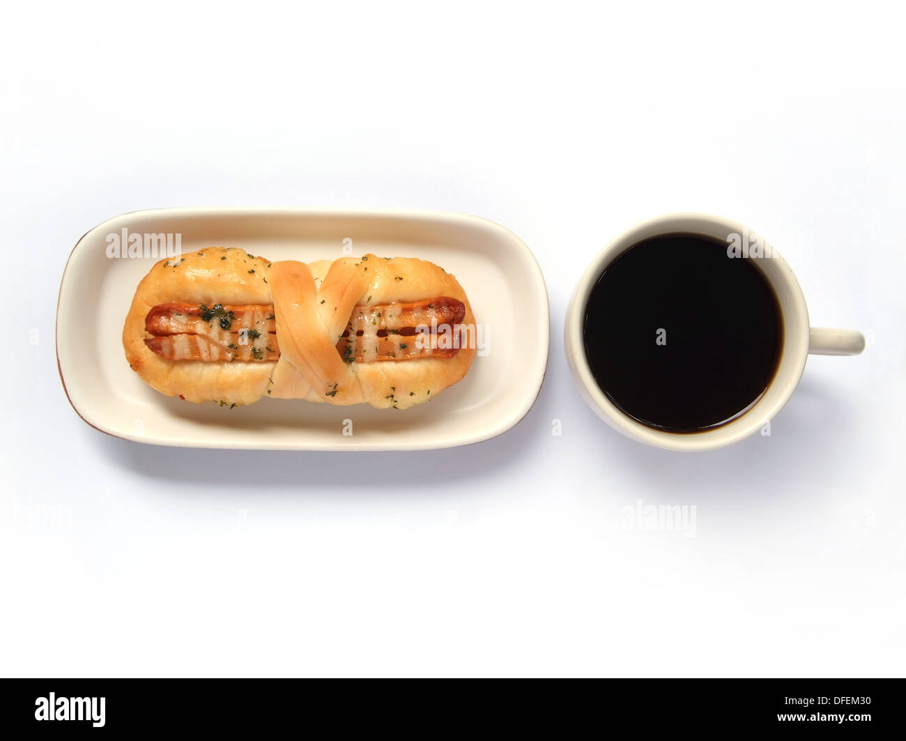 Appetizing sausage bread and cup of coffee isolated on a white ...
