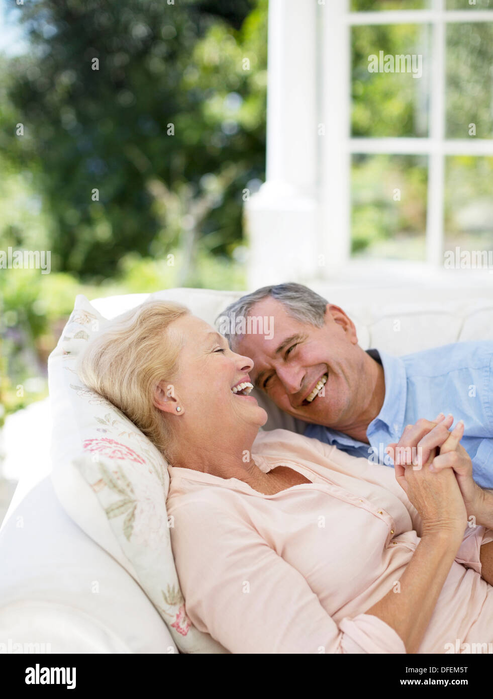 Man laying on settee hi-res stock photography and images - Alamy