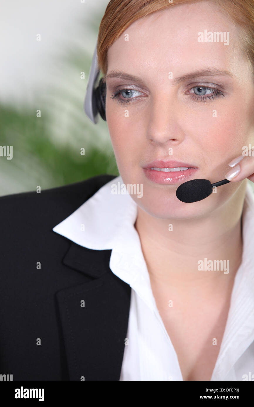 Receptionist with head-set Stock Photo - Alamy