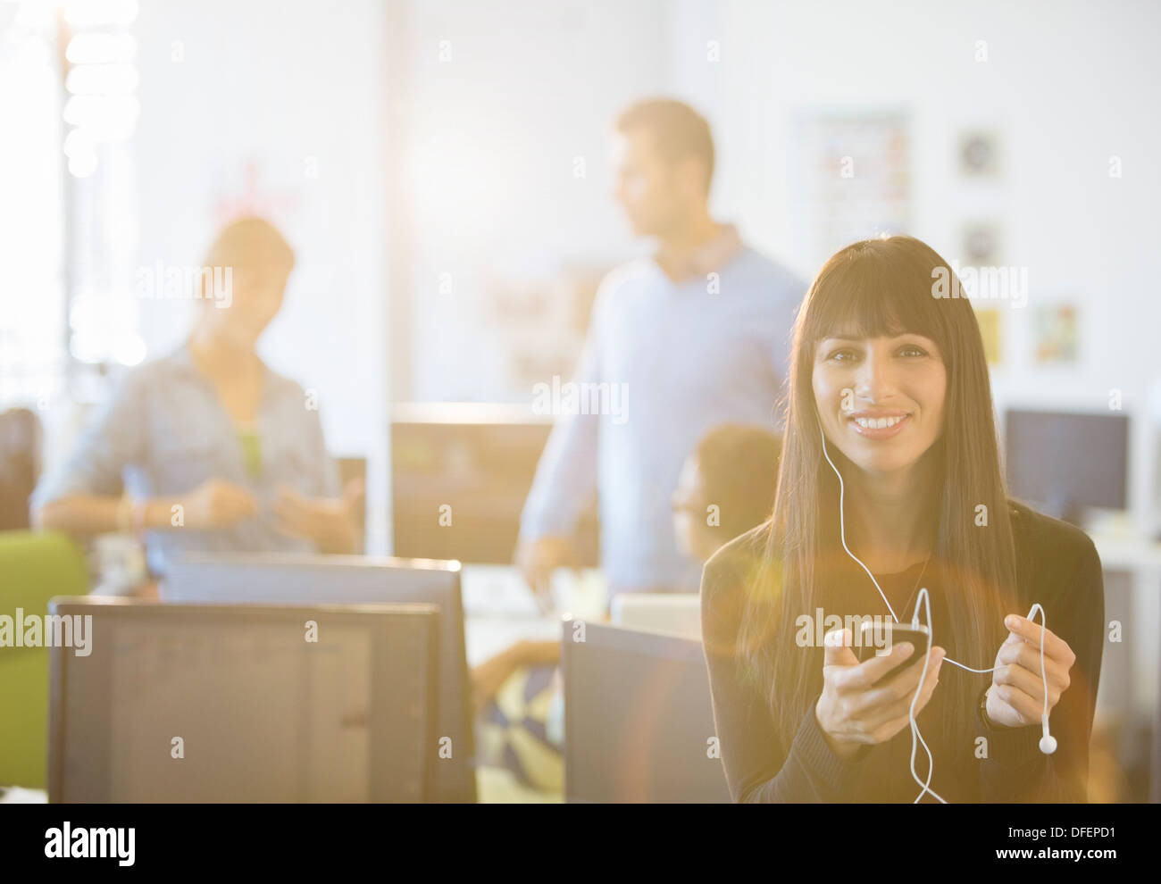 Young man holding mp3 player hi-res stock photography and images - Alamy