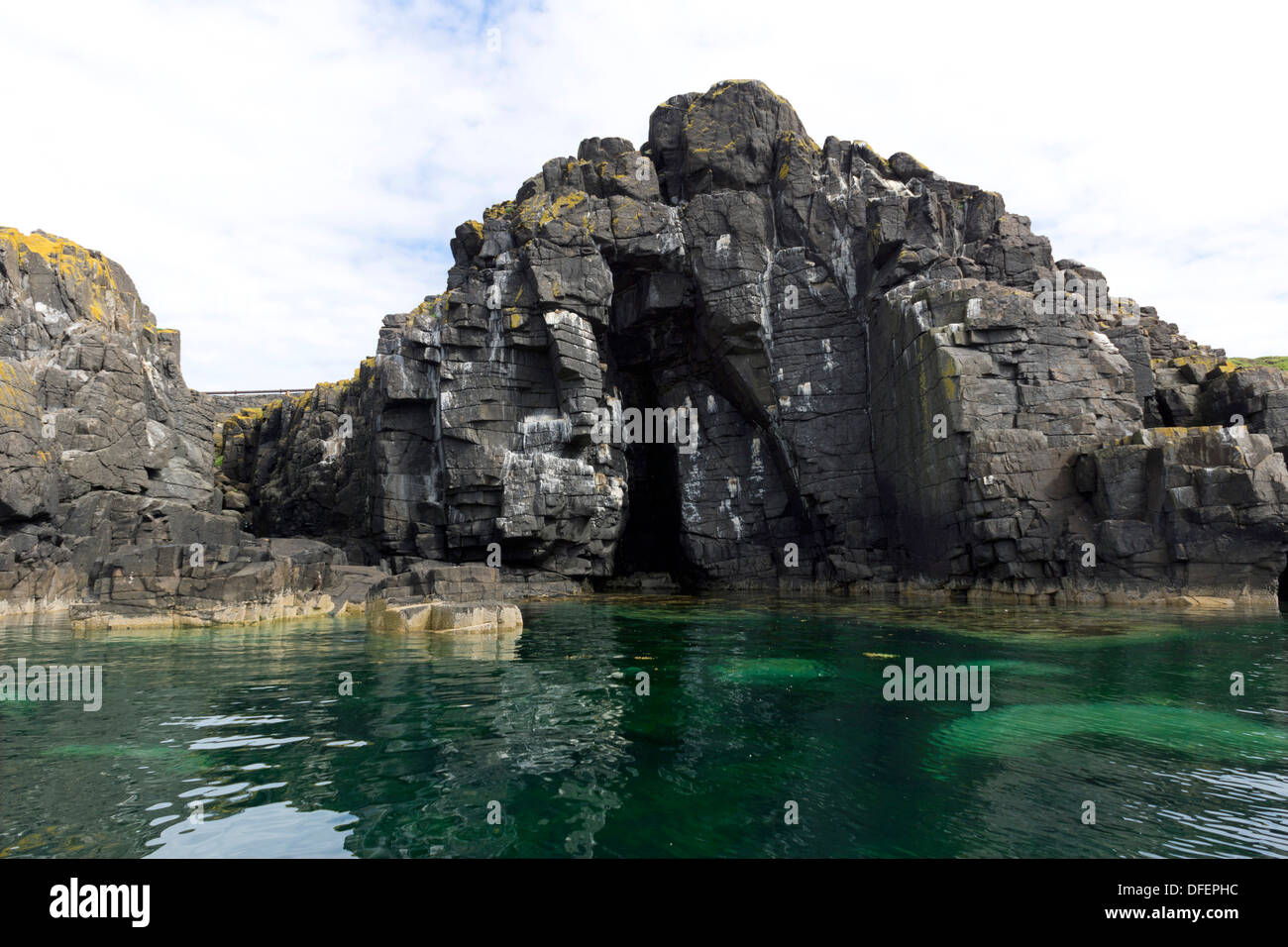 Cliffs, and clear green water at the Isle of May in the Firth of Forth ...