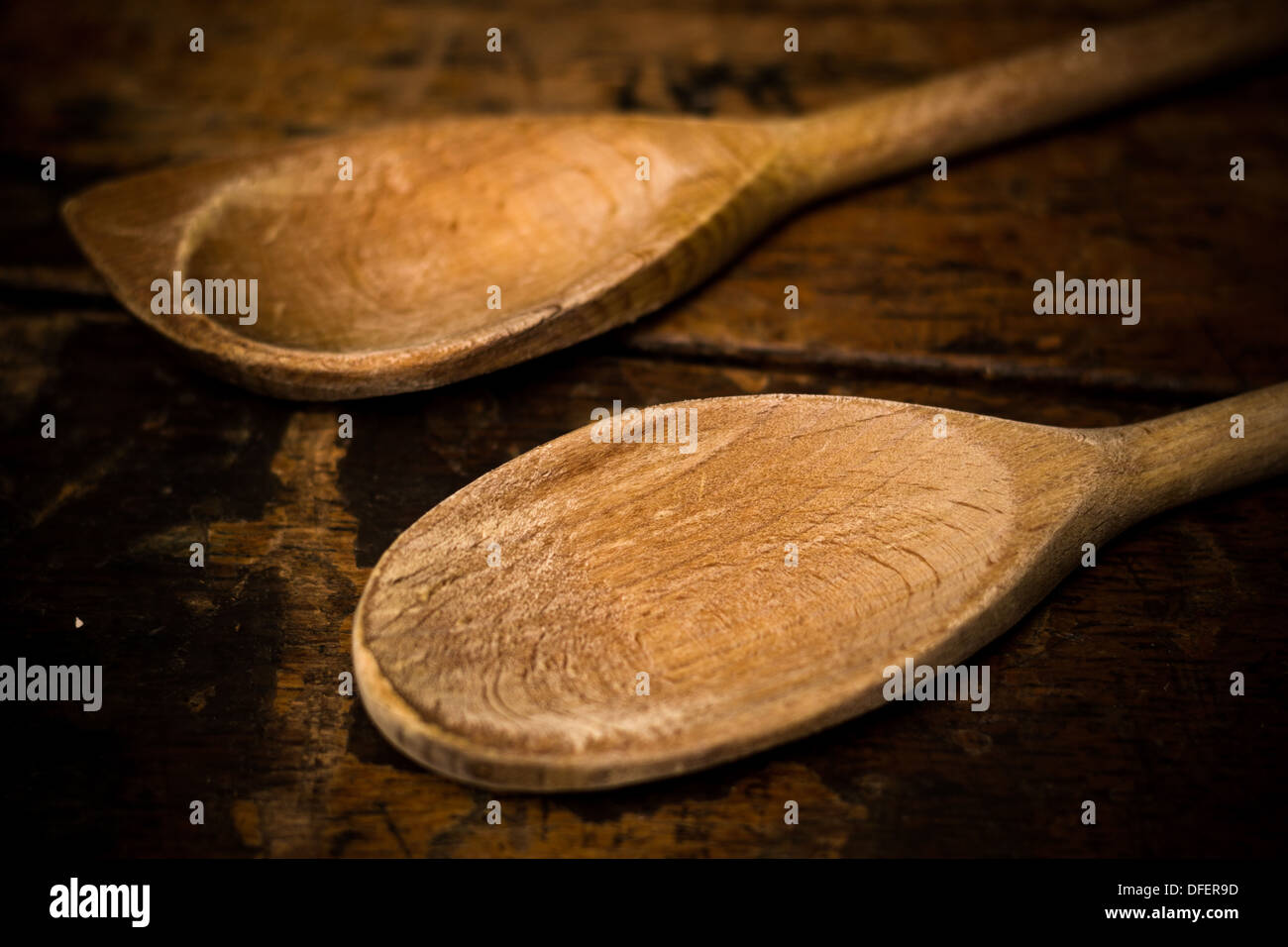 Two wooden spoon on wood surface Stock Photo - Alamy