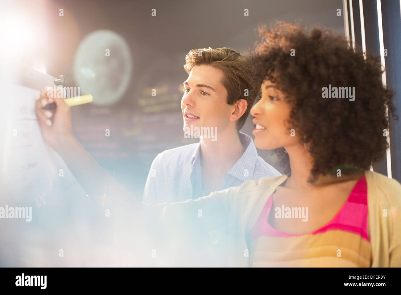 Business people writing on office whiteboard Stock Photo - Alamy