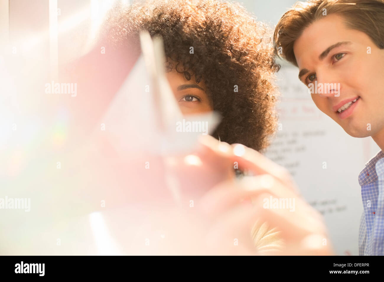 Business people looking at model Stock Photo - Alamy