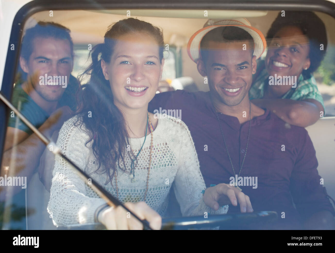 Friends riding in van Stock Photo - Alamy