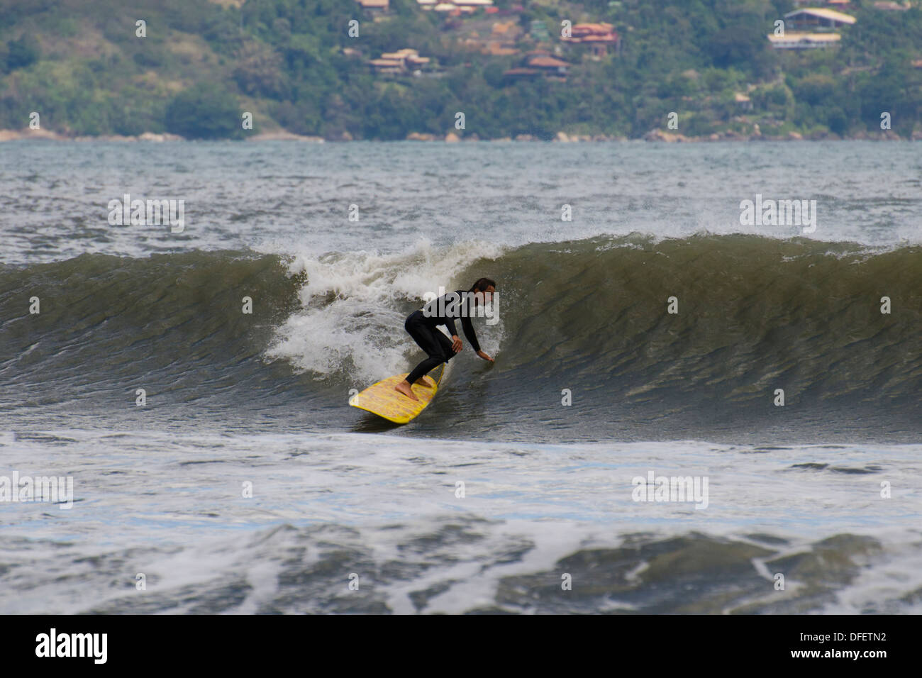 surfboarding at Guaeca beach, north shore of Sao Paulo state, Brazil ...