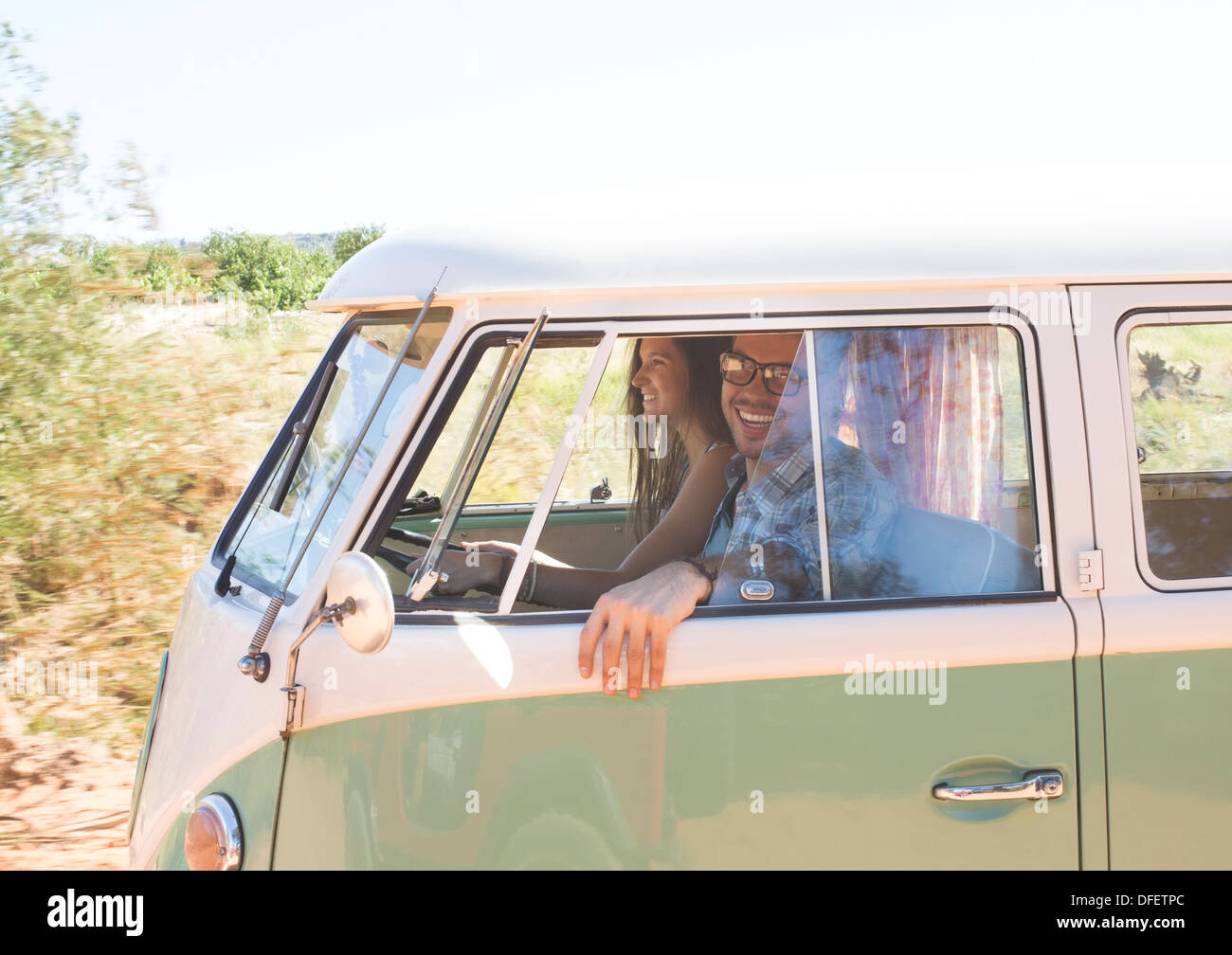 Couple in camper van Stock Photo - Alamy