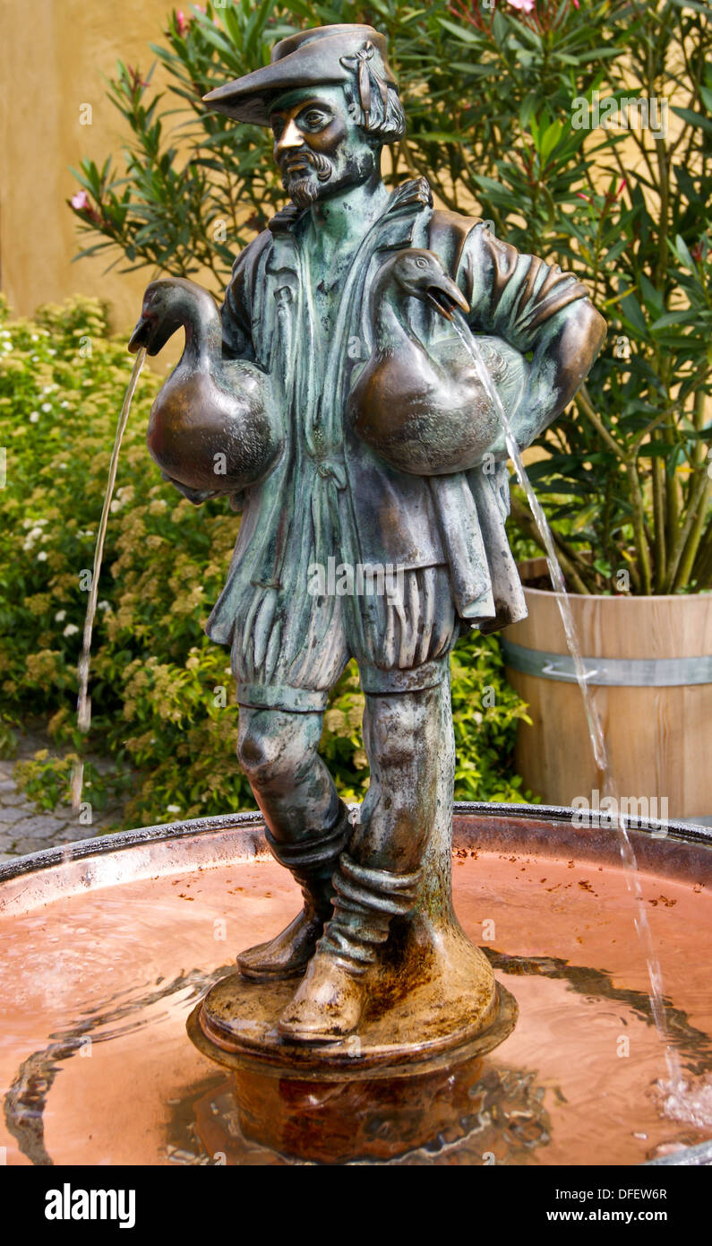 Fountain statue of a farmer with two swans, Schloss Hohenschwangau ...