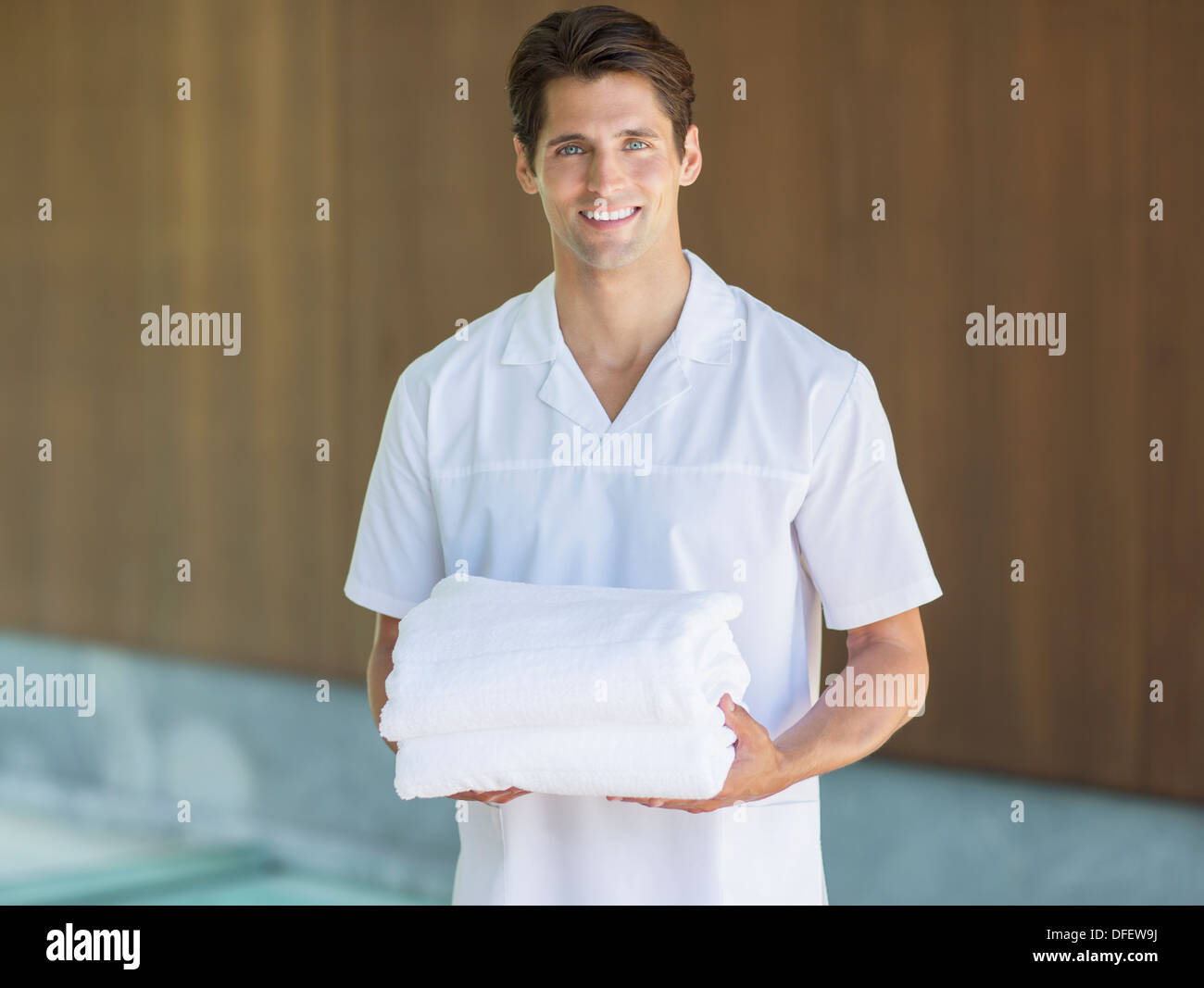Holding towel hi-res stock photography and images - Alamy