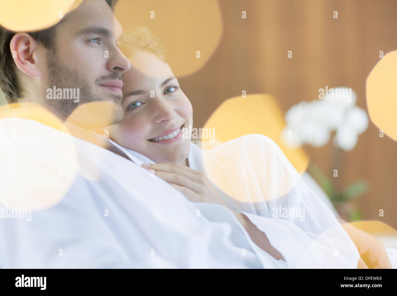 Couple hugging in bathrobes Stock Photo - Alamy