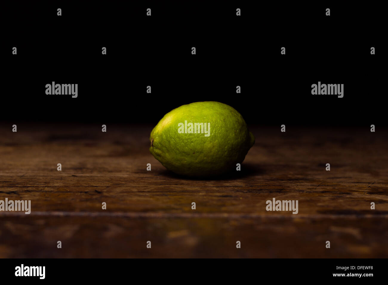 Lime on wood surface Stock Photo - Alamy