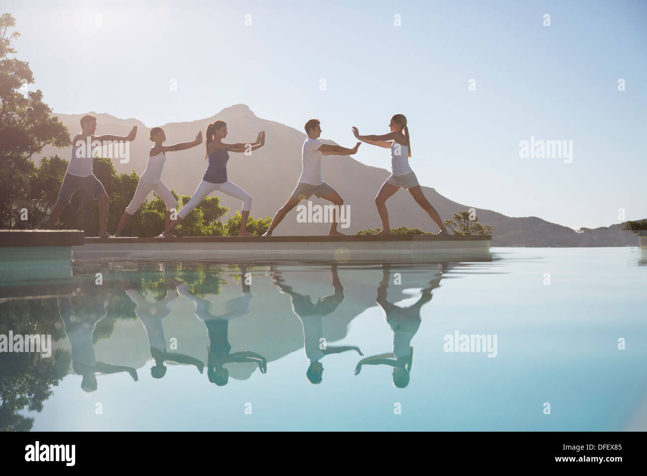 People practicing tai chi poolside Stock Photo - Alamy