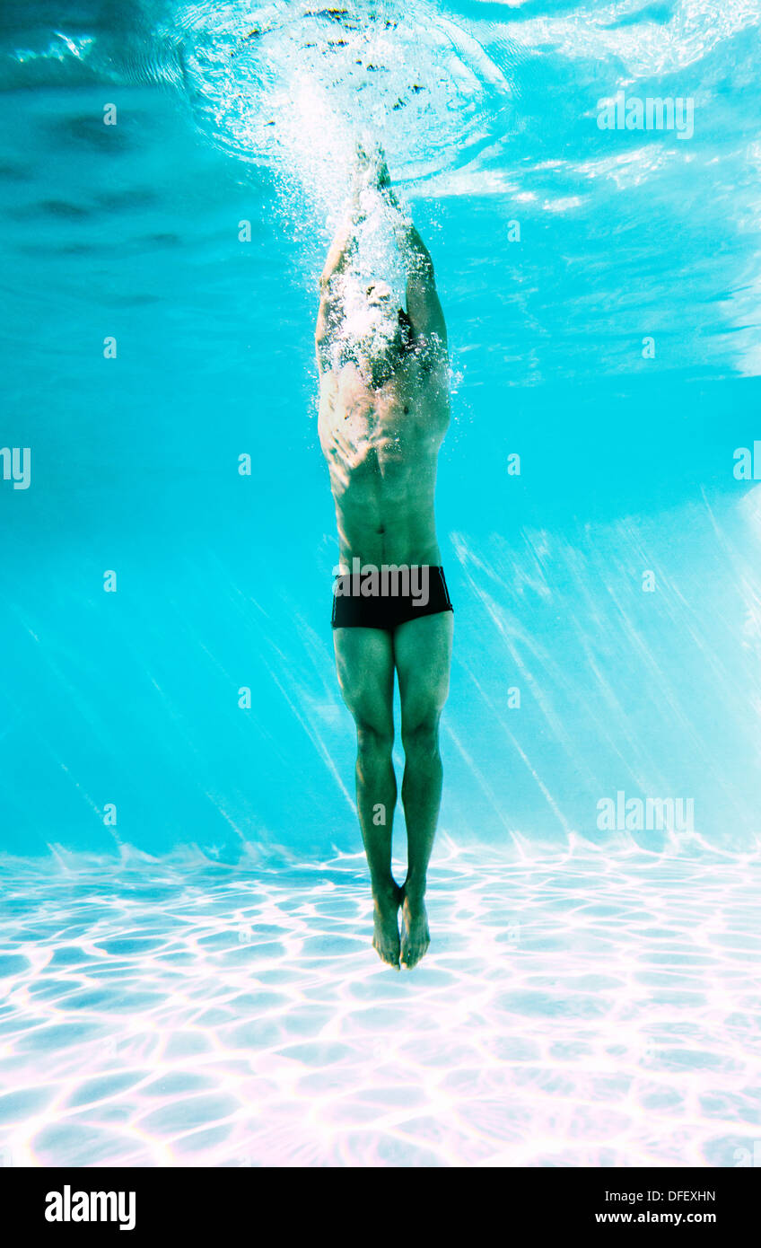 Man underwater in swimming pool Stock Photo - Alamy