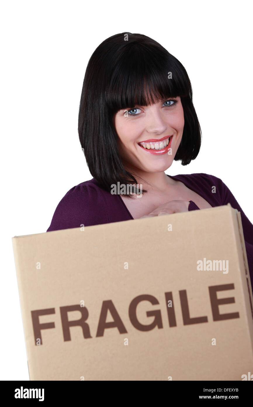 Woman with a box marked fragile Stock Photo - Alamy