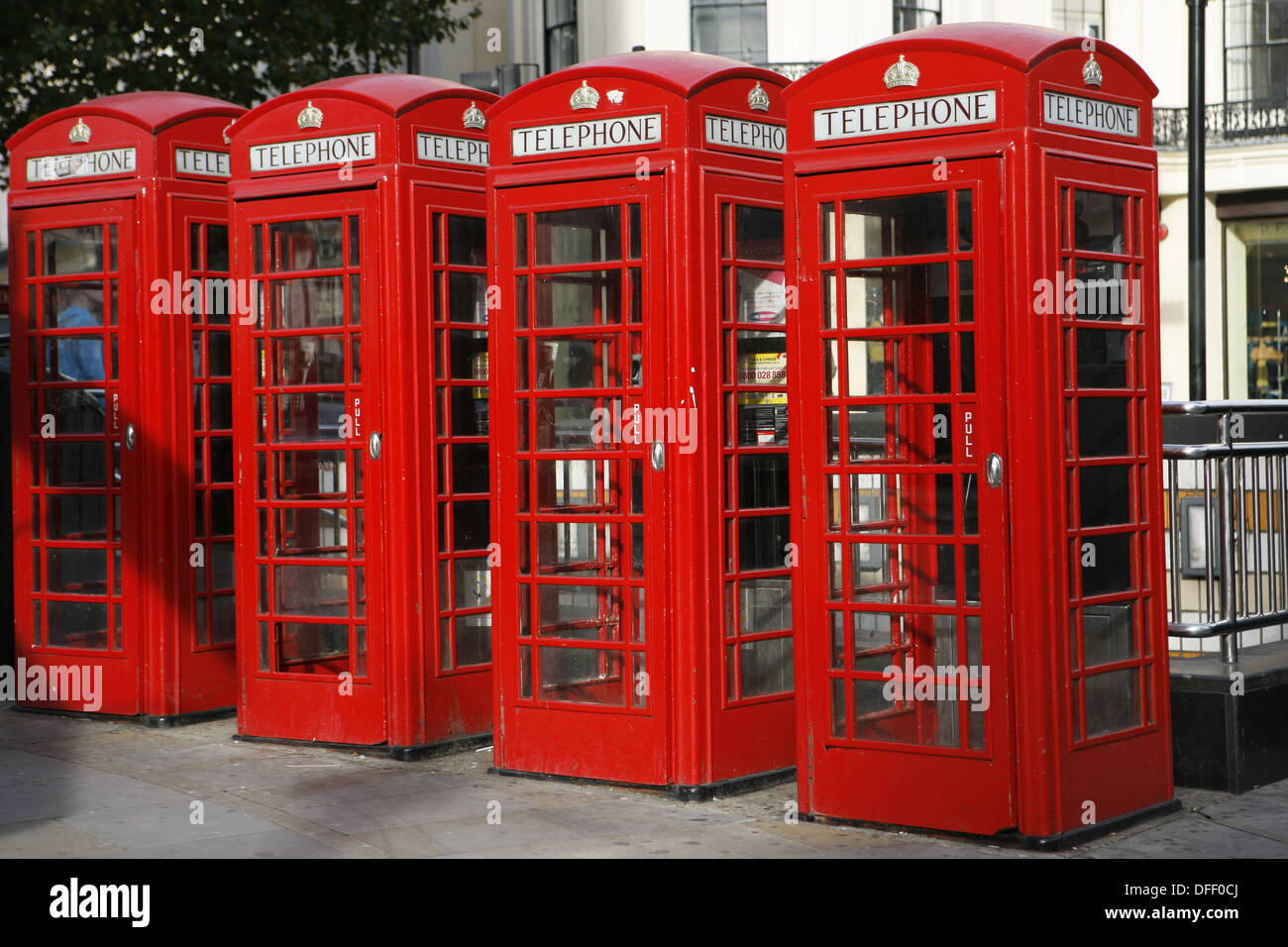 Row of red telephone boxes in street Stock Photo - Alamy