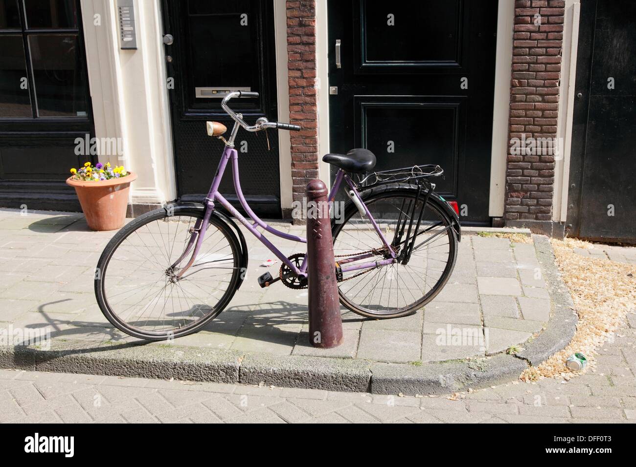 Bicycle on the pavement, Amsterdam, The Netherlands Stock Photo - Alamy