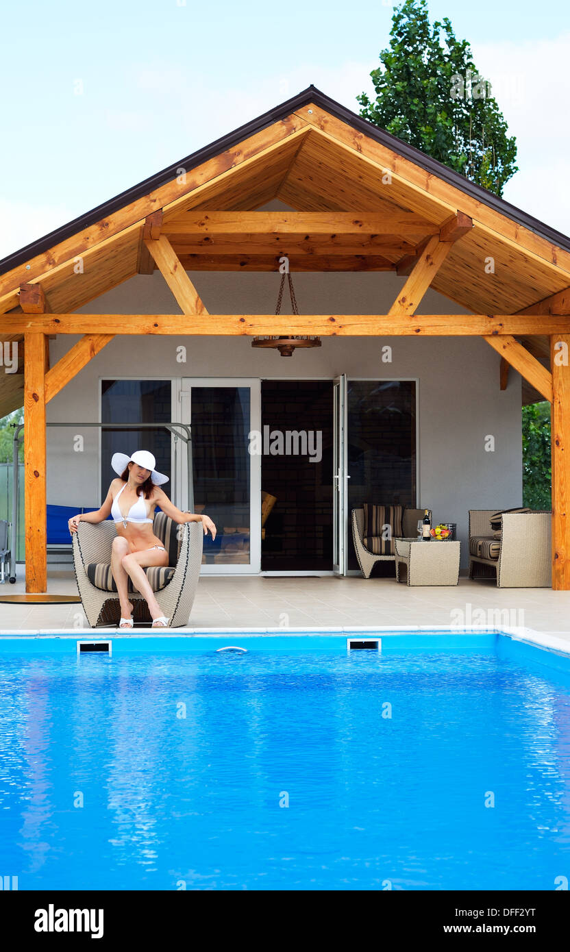 Woman resting at the pool Stock Photo - Alamy