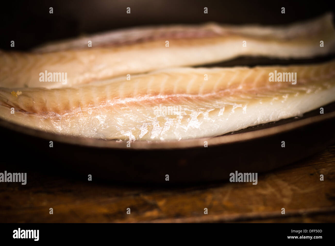 Two cod fillets in frying pan Stock Photo - Alamy