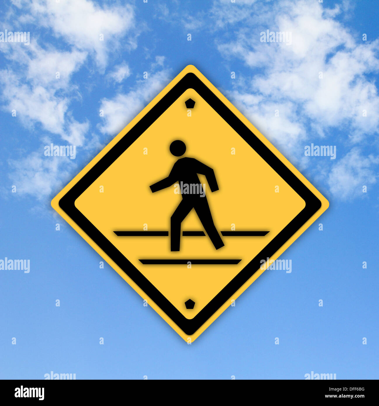Crosswalk sign with a man walking on yellow with a blue sky background ...
