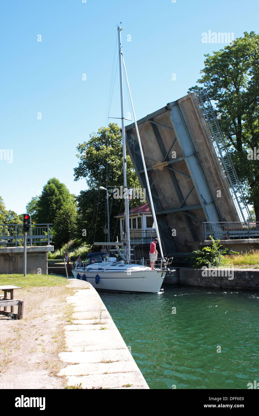 A yacht exits the Gota Canal and enters Lake Vattern Motala Sweden ...