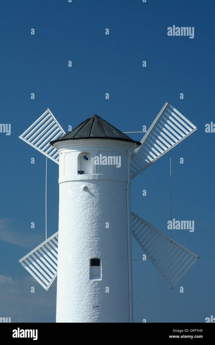 Windmill that is also a lighthouse at the entry to the port of ...