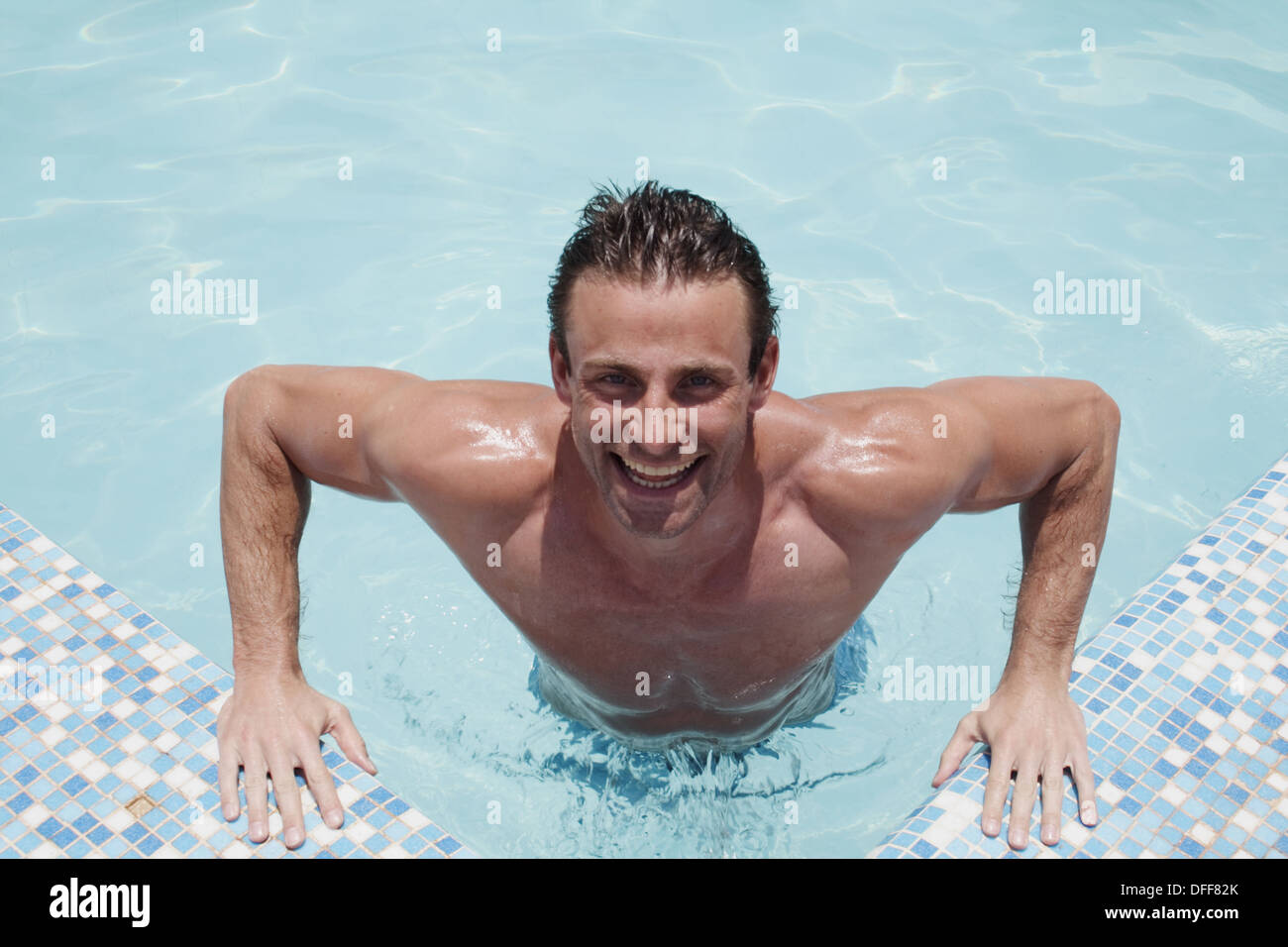 Good looking man in swimming pool hi-res stock photography and images ...