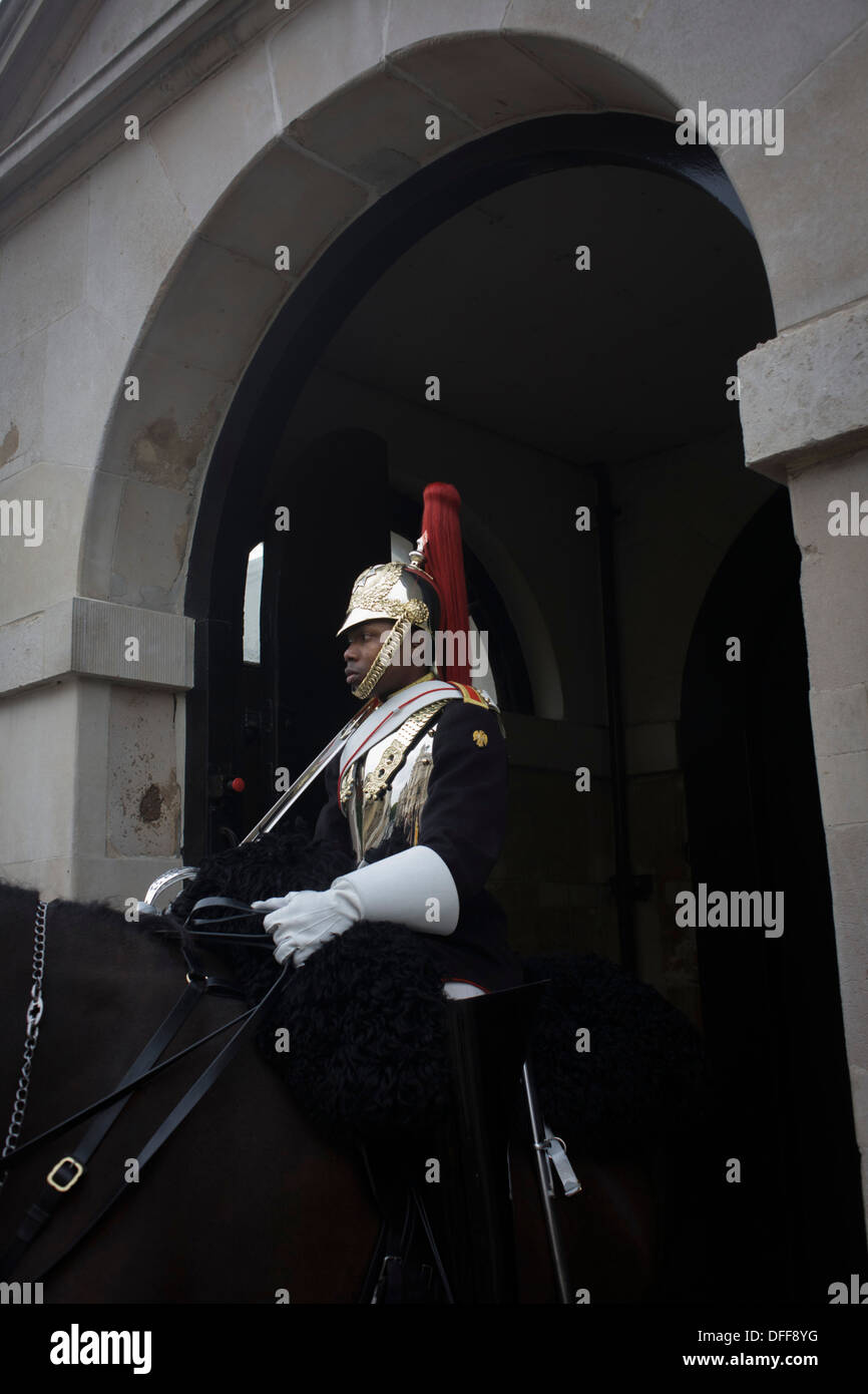 A black mounted lifeguard trooper parades at Horseguards in Whitehall ...