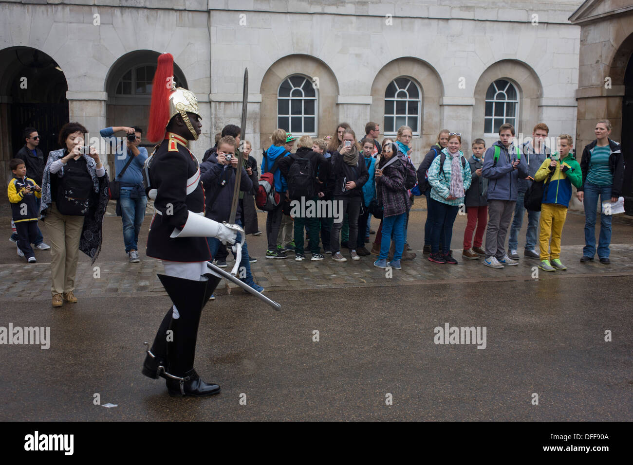 A black mounted lifeguard trooper parades at Horseguards in Whitehall ...
