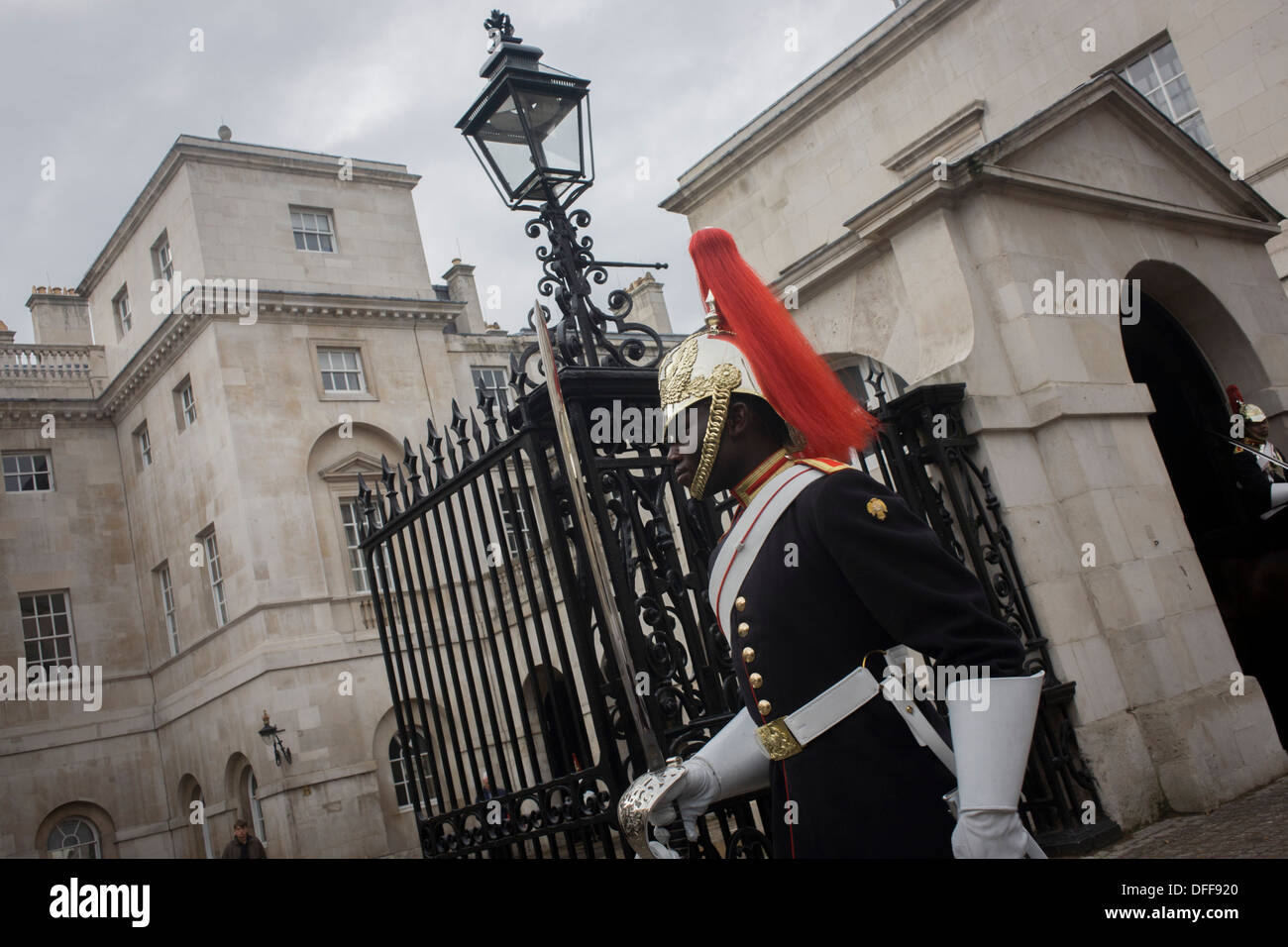 A black mounted lifeguard trooper parades at Horseguards in Whitehall ...
