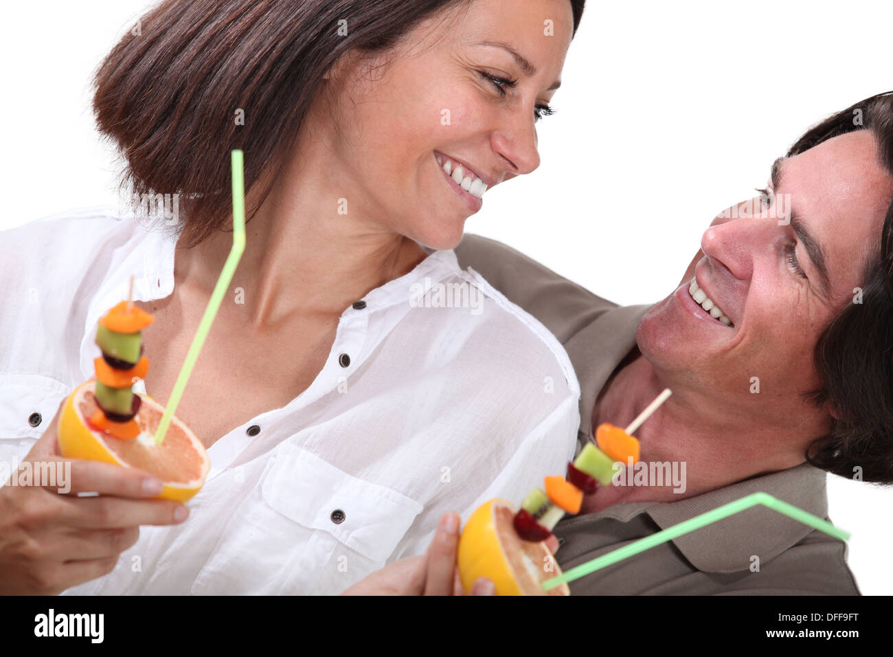 Couple eating fruit Stock Photo - Alamy