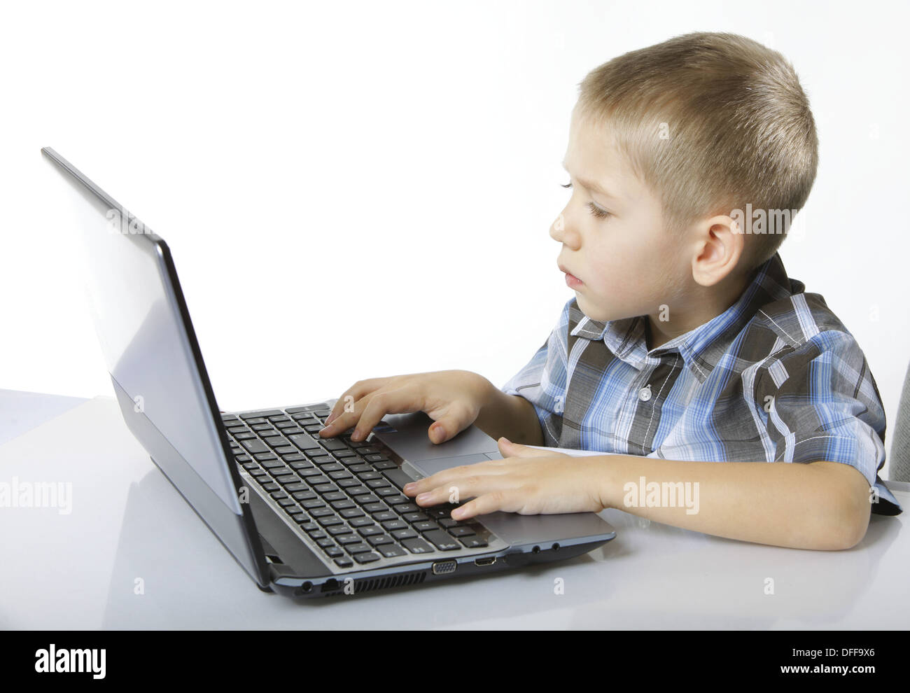 Computer addiction child boy with laptop notebook white background ...