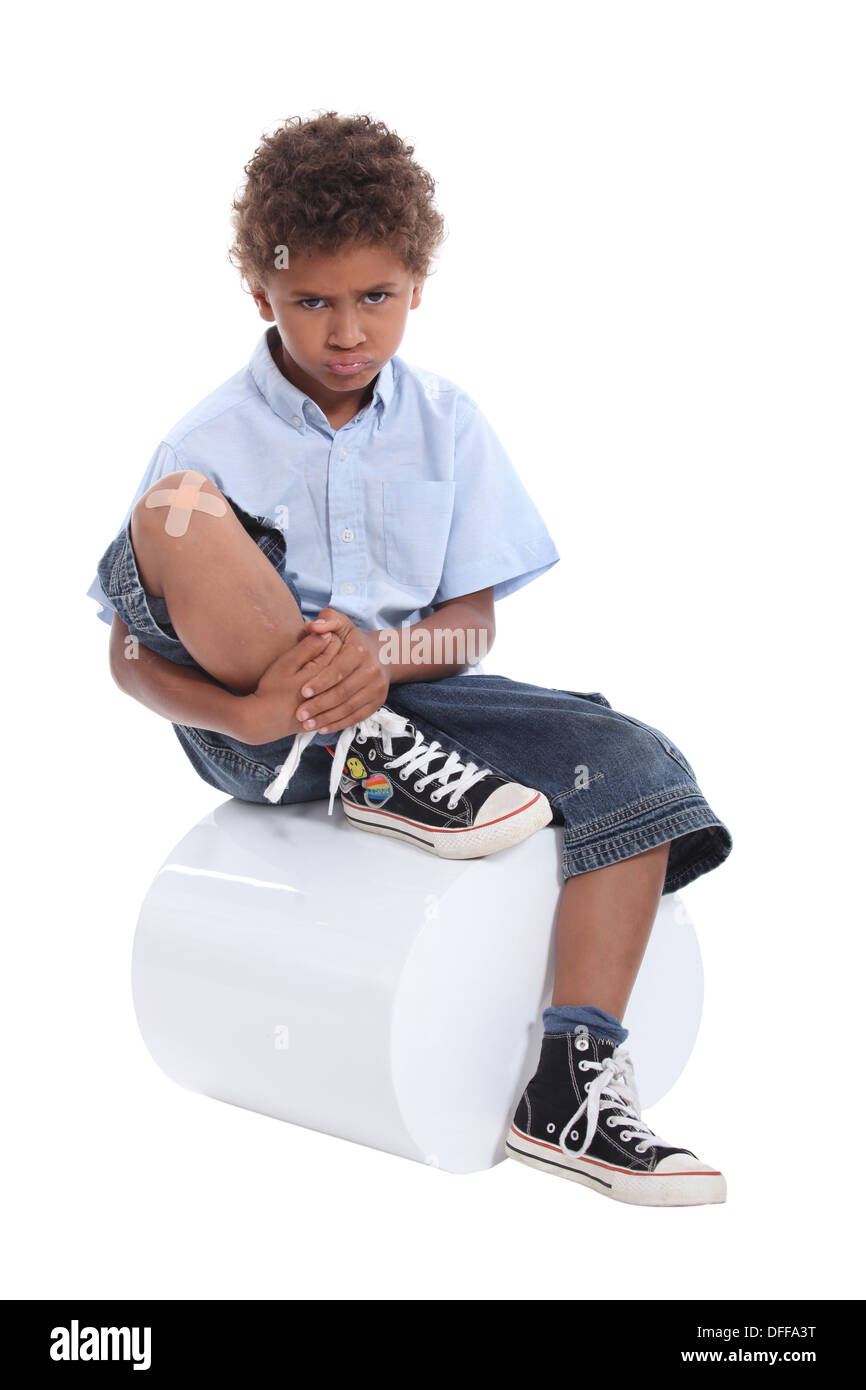 Little boy with a plaster on his knee Stock Photo - Alamy