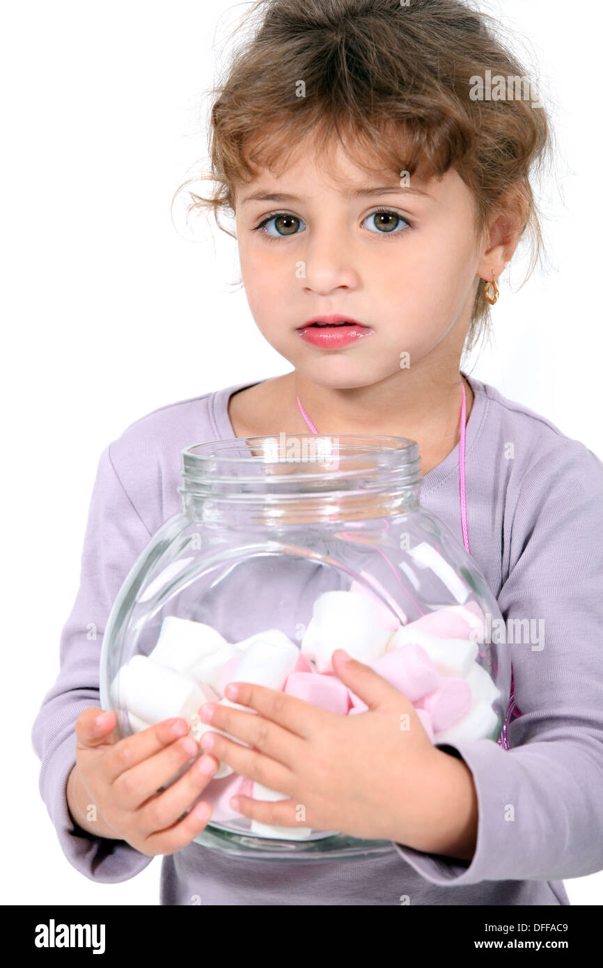 Girl with candy jar Stock Photo - Alamy