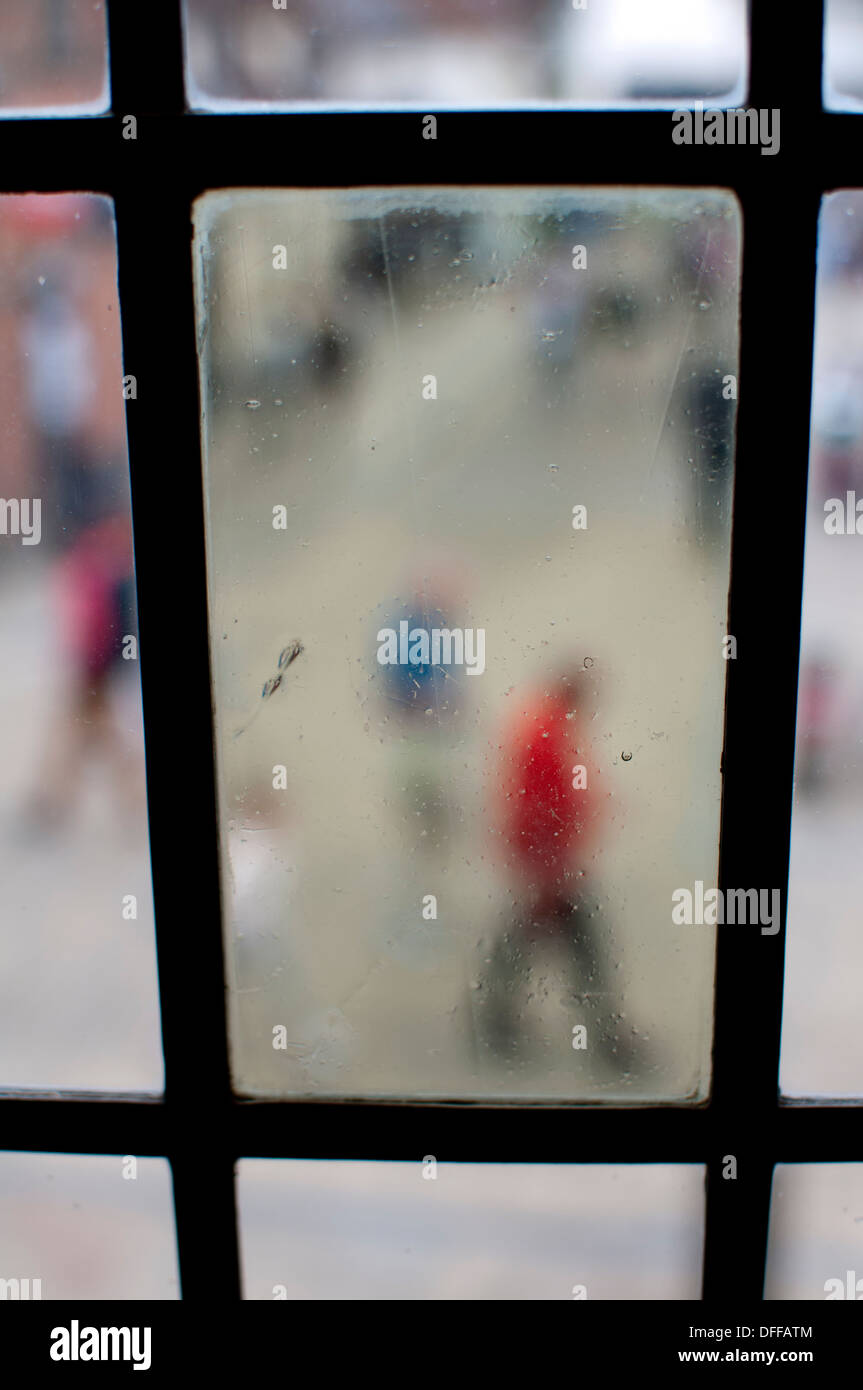 Out of focus people through a leaded window Stock Photo - Alamy