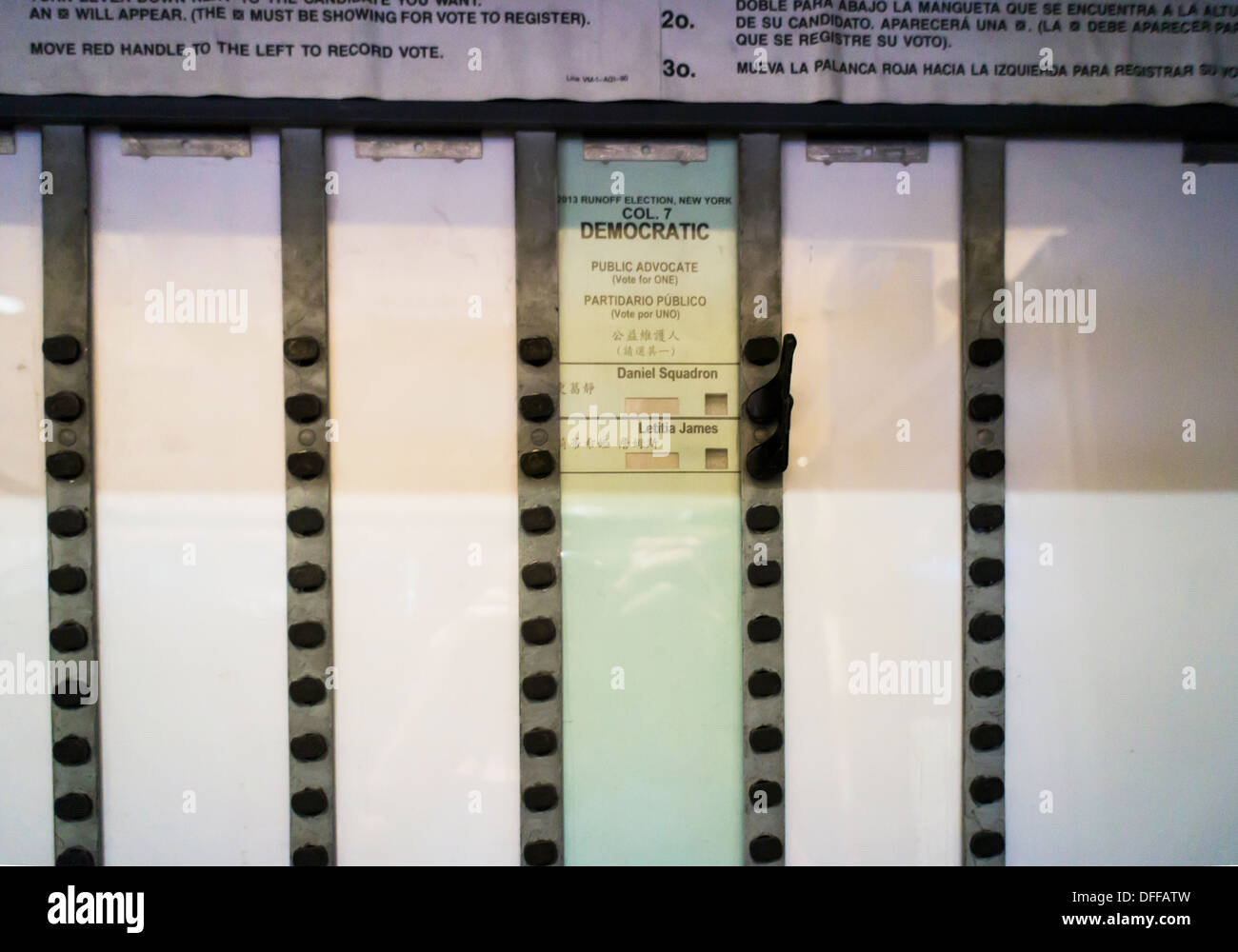 Levers and ballots on a mechanical voting machine in a polling station ...