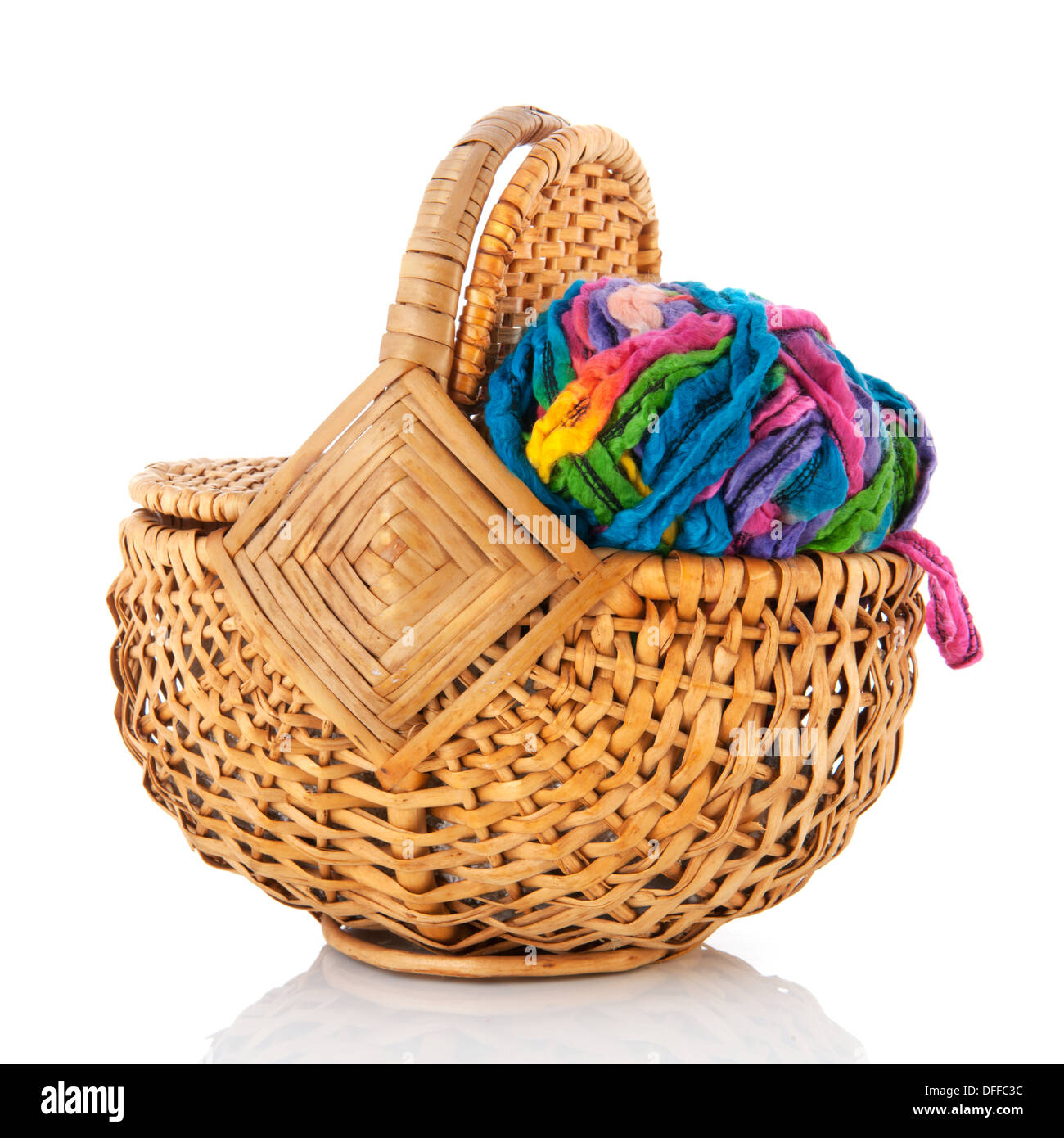 Modern ball wool in many colors in basket isolated over white ...
